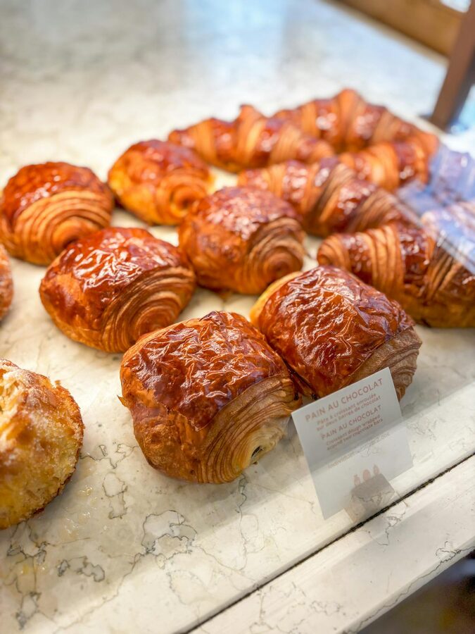 Freshly baked pastries displayed in a Parisian bakery
