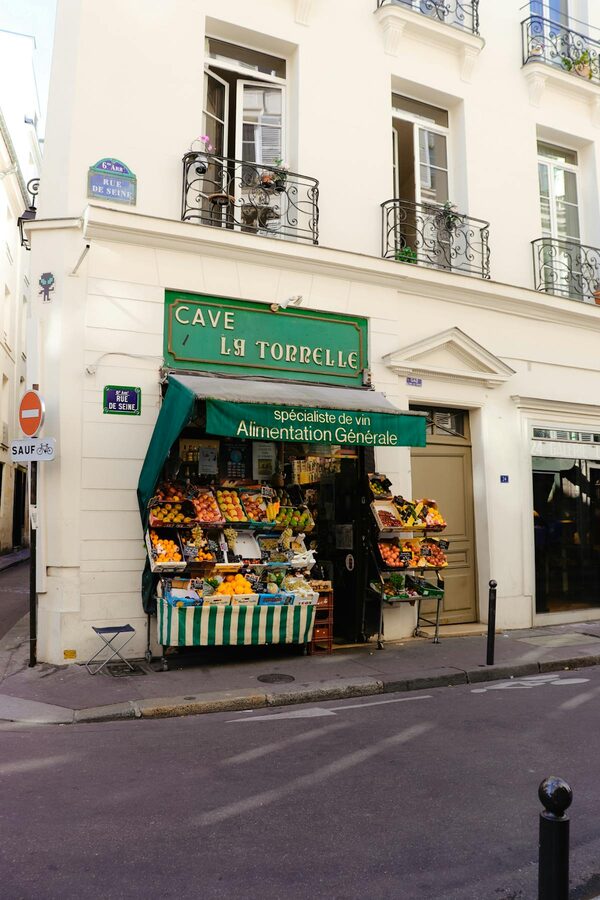 French wine and fruit shop on a street corner