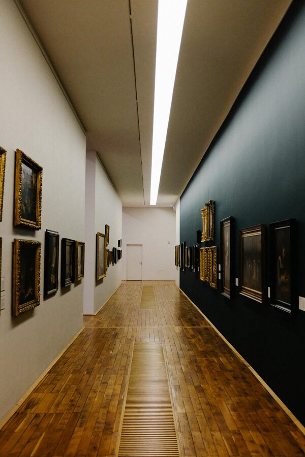 Museum corridor with classic framed paintings