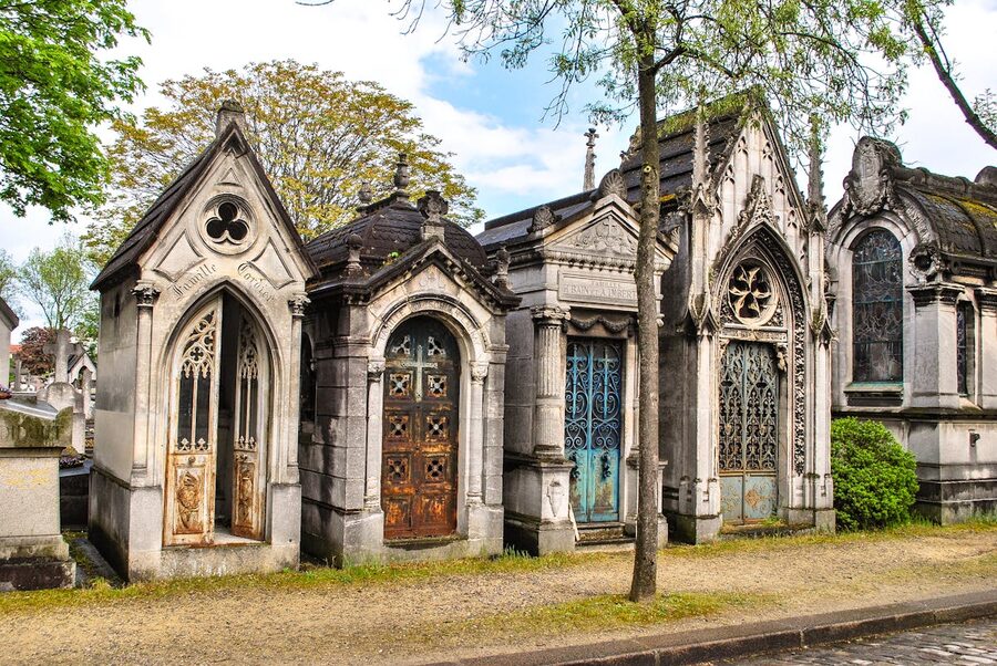 Row of ornate mausoleums at Père Lachaise Cemetery