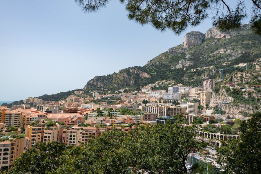 Monaco cityscape with mountains behind and Mediterranean in front