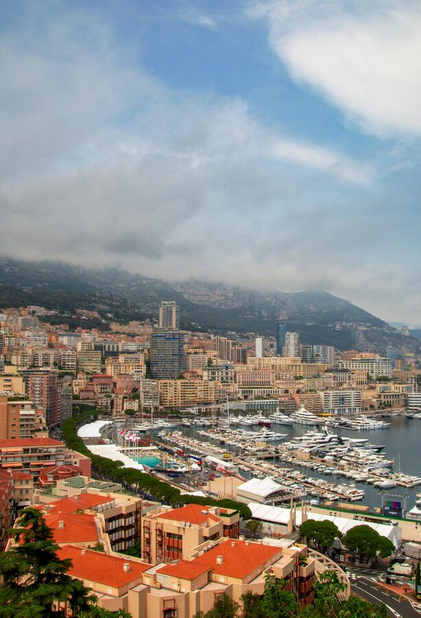 Aerial view of Monaco harbor with yachts and buildings