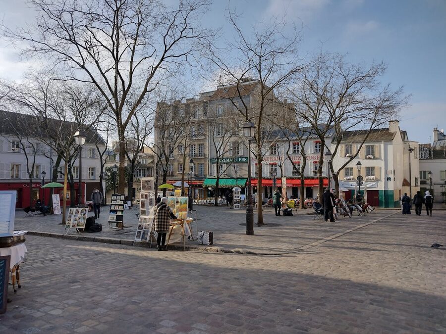 Montmartre street with artists displaying paintings along the pavement