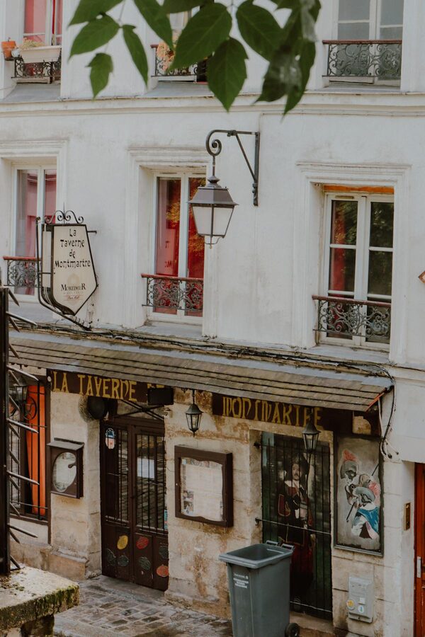 Historic La Taverne de Montmartre building with classic Parisian architecture