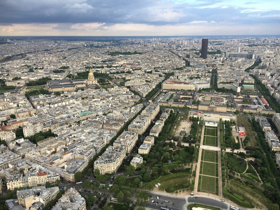 Aerial view of Paris showing the Eiffel Tower and surrounding landmarks from above