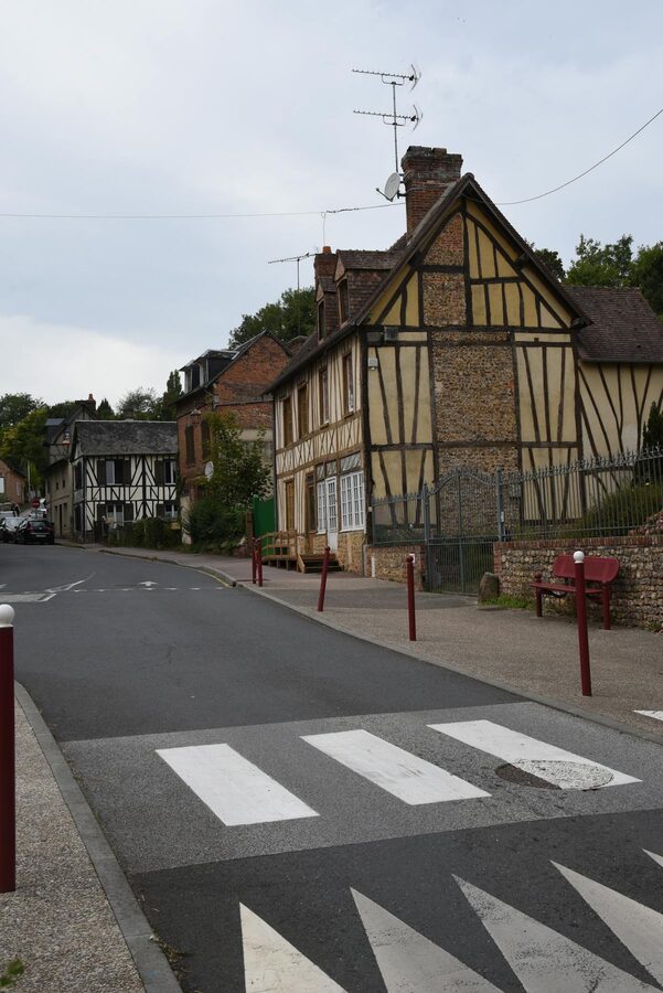 Charming half-timbered houses on a street in Normandy France