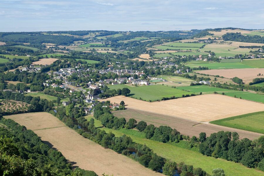 Aerial view of a village and lush countryside in Normandy France