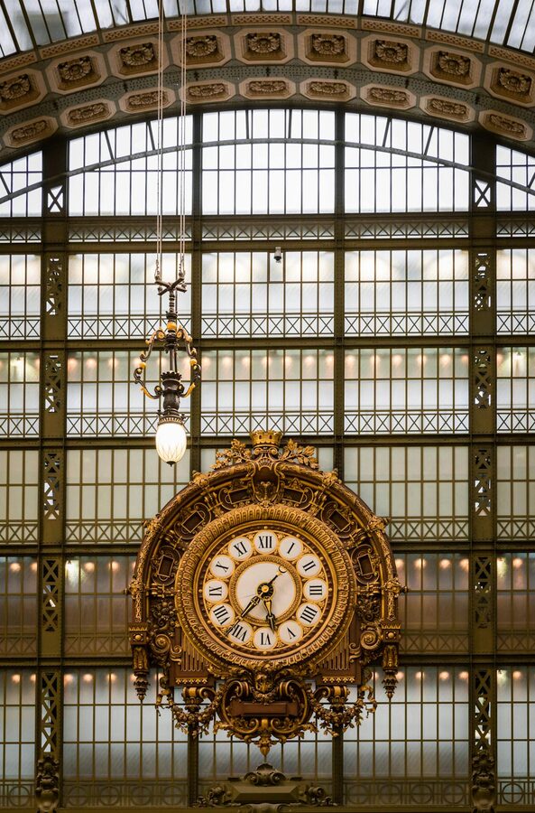 The golden ornate clock inside the Musée d'Orsay