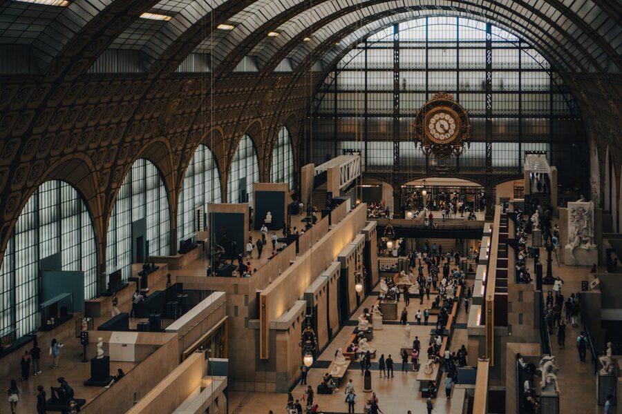 View through the Musée d'Orsay's clock with visitors silhouetted