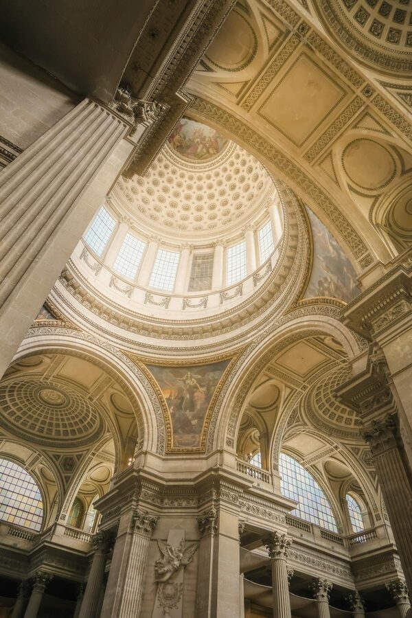 Looking up at the Panthéon dome with detailed frescoes and architectural ornamentation