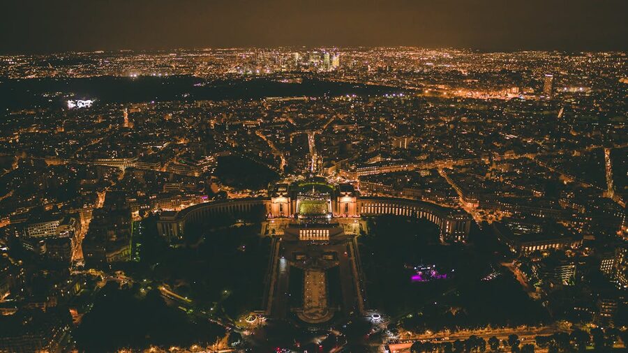 Paris city lights at night from aerial view