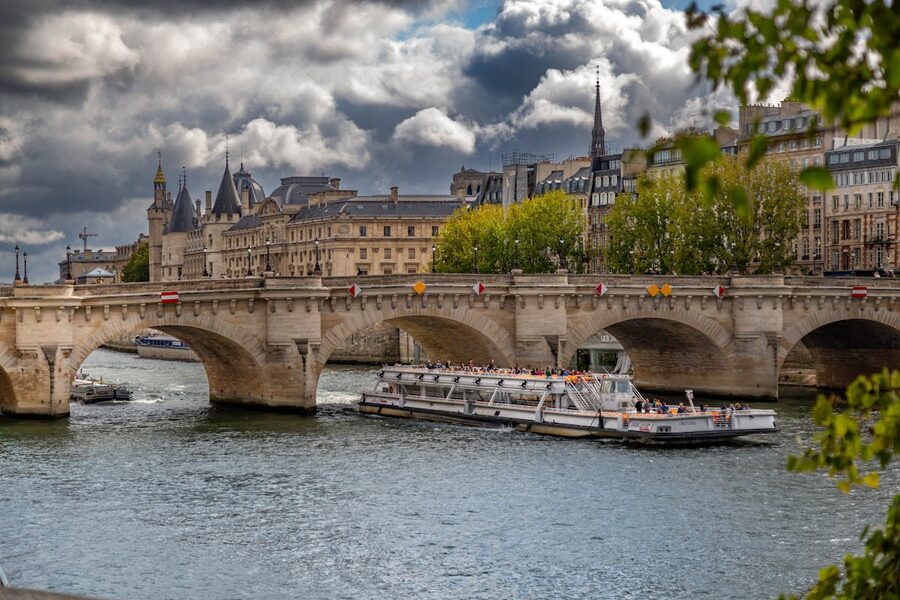 A cruise boat on the Seine with Parisian buildings in the background