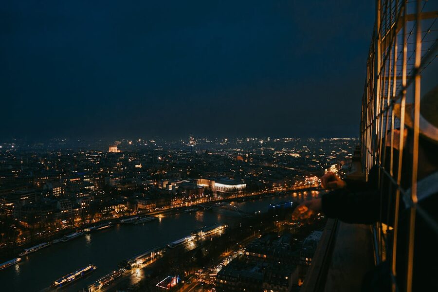 Paris cityscape at night with thousands of lights seen from an observation deck