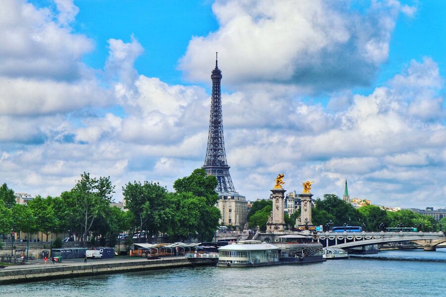 The Eiffel Tower and Seine at sunset with warm golden light