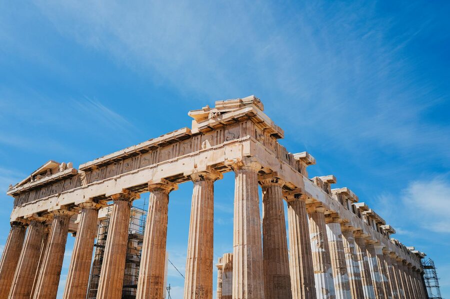 The Parthenon columns in Athens against a clear blue sky