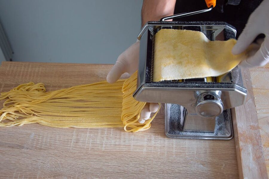 Pasta maker creating fresh spaghetti