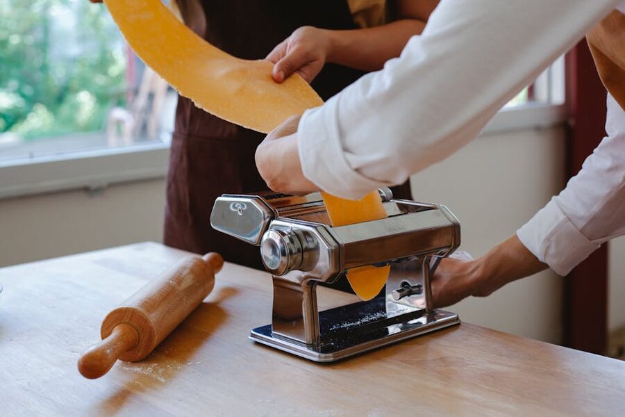 Pasta maker rolling dough