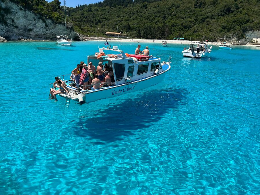 Tourist boat on the blue waters of Paxos
