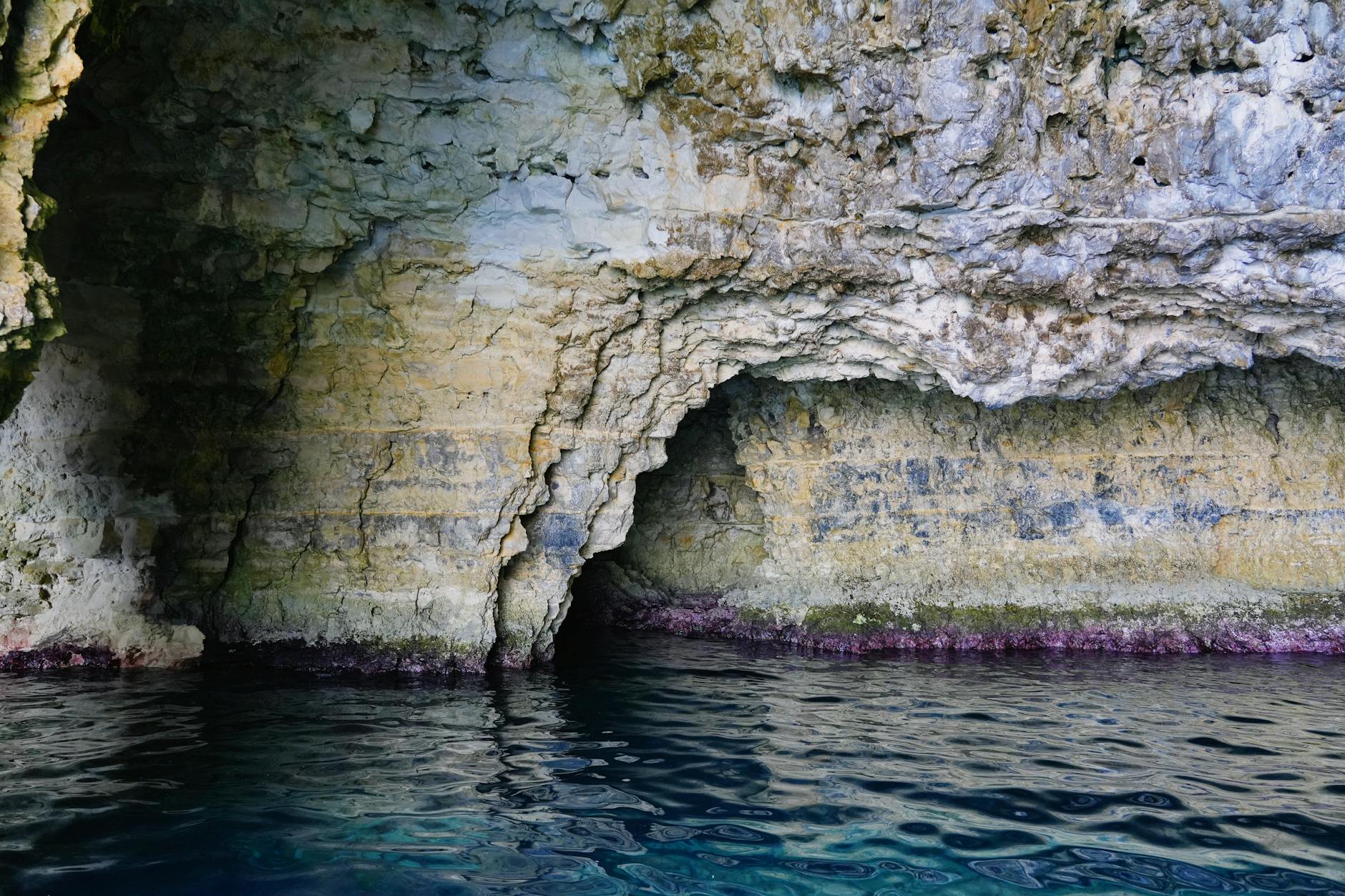 Natural cave formations along the Paxos coastline