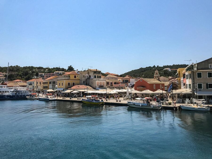 Scenic waterfront view of a Paxos village with moored boats