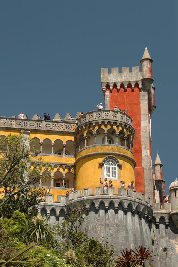 Red and yellow walls of Pena Palace exterior in Sintra Portugal