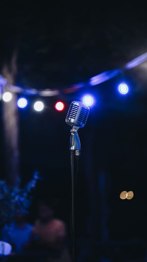 Microphone on a stage with lights in the background