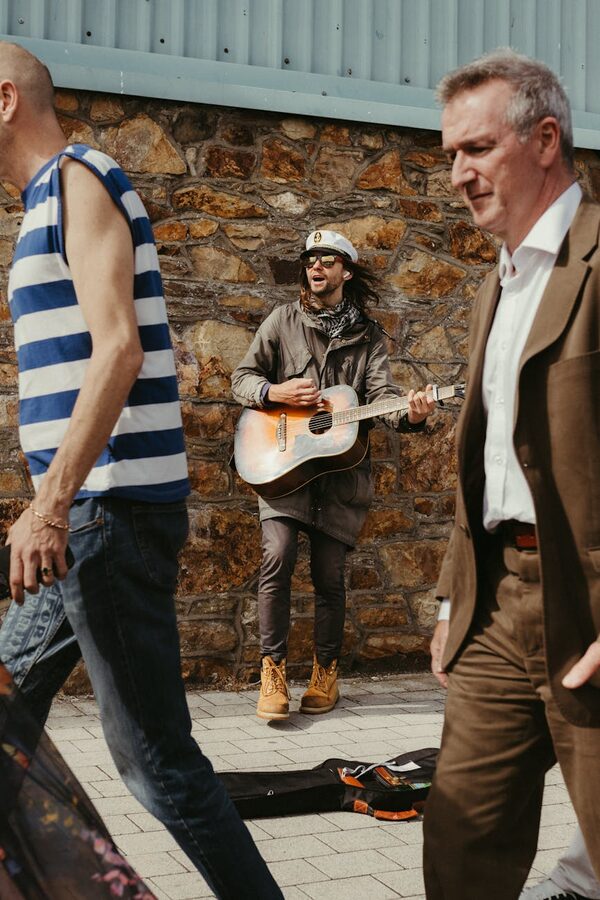Street musician playing guitar in Dublin