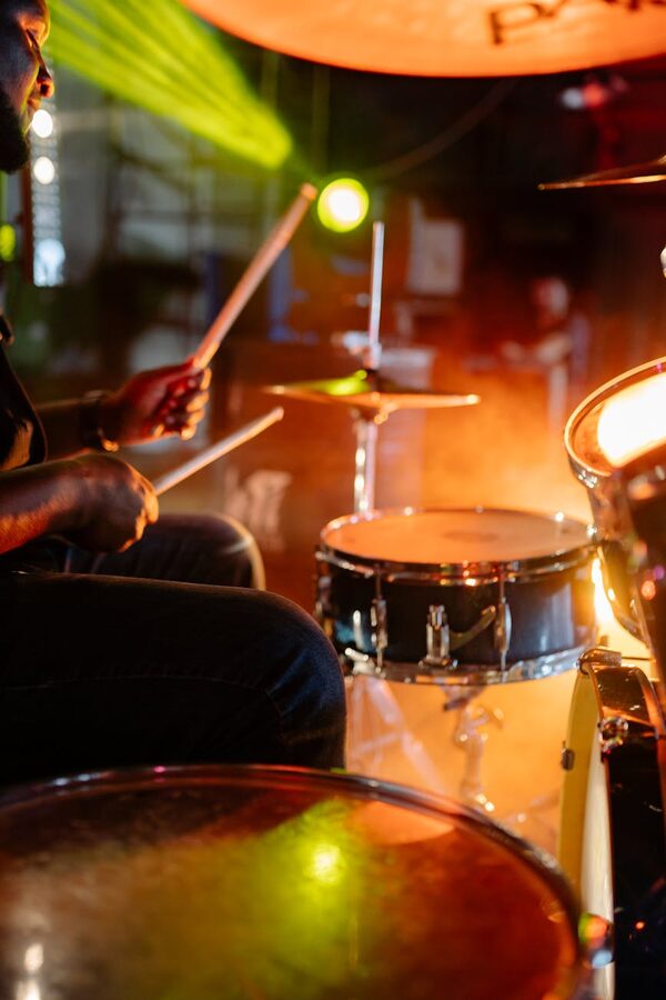 Drummer playing drums with sticks