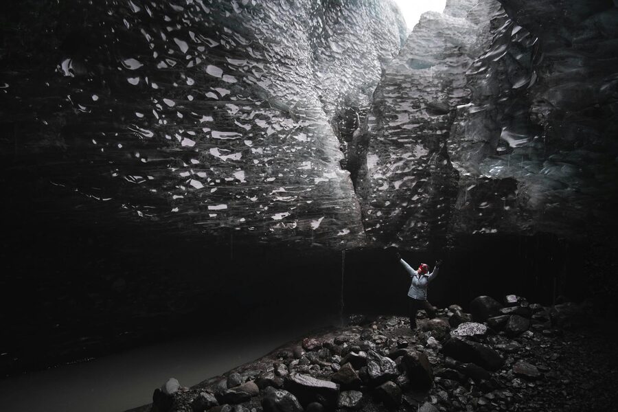 Narrow ice passage winding deeper into a glacier
