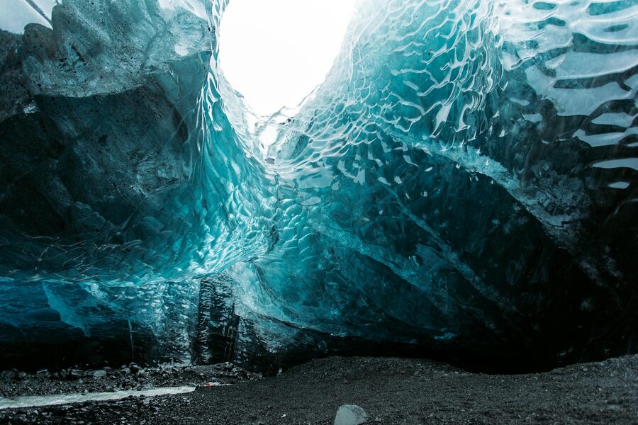 Dramatic blue walls of an ice cave deep inside a glacier