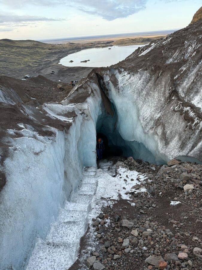 Tour group exploring the interior of an Iceland ice cave