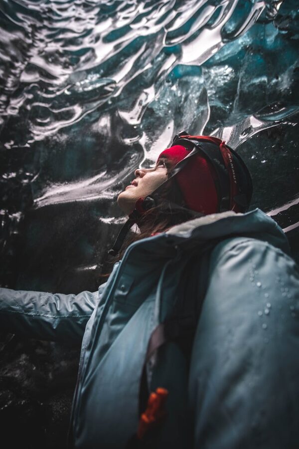Narrow ice passage winding deeper into a glacier
