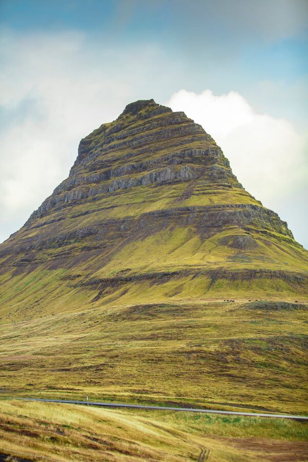 Kirkjufell mountain with its signature waterfall in the foreground