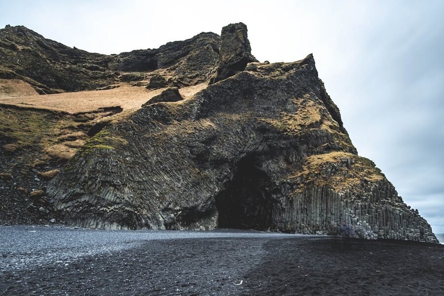 Basalt column cave on black sand beach Iceland