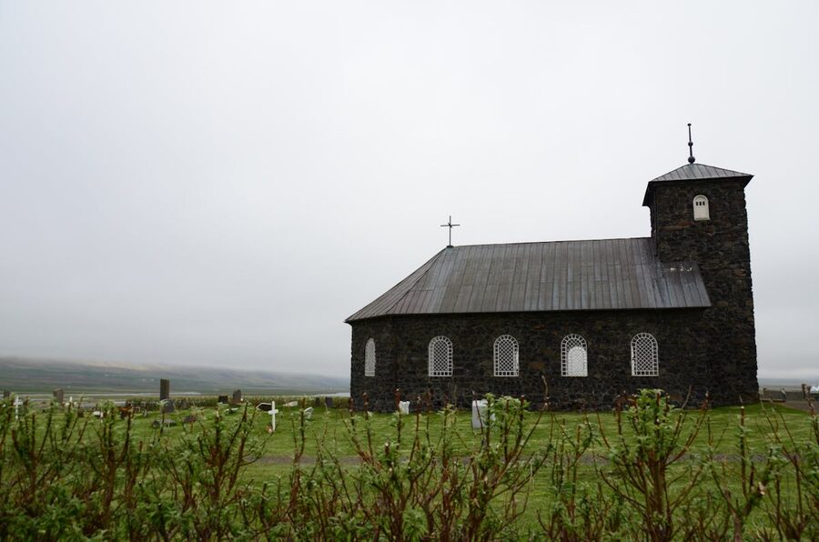 Traditional Iceland church in green countryside