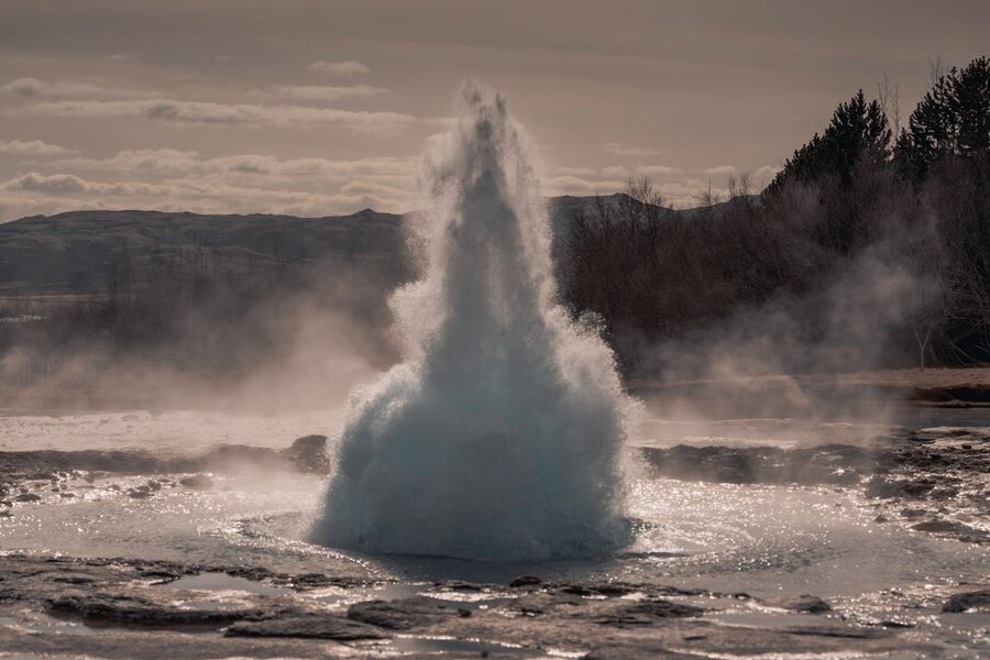 Strokkur geyser erupting dramatically in Iceland