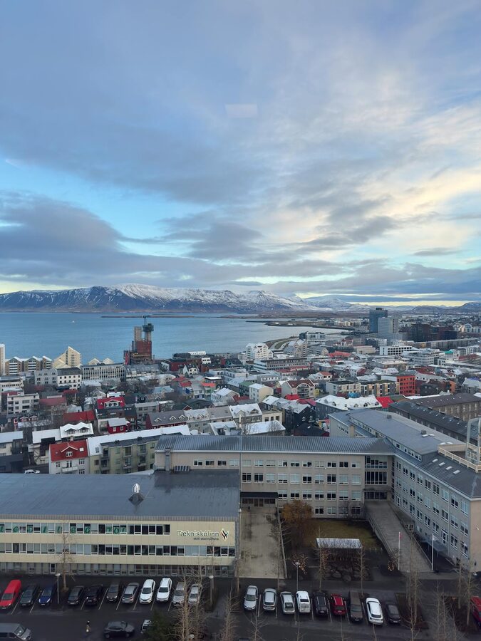 Aerial view of Reykjavik with snowy mountains backdrop