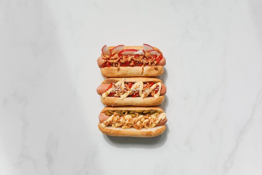 Gourmet hot dogs with various toppings