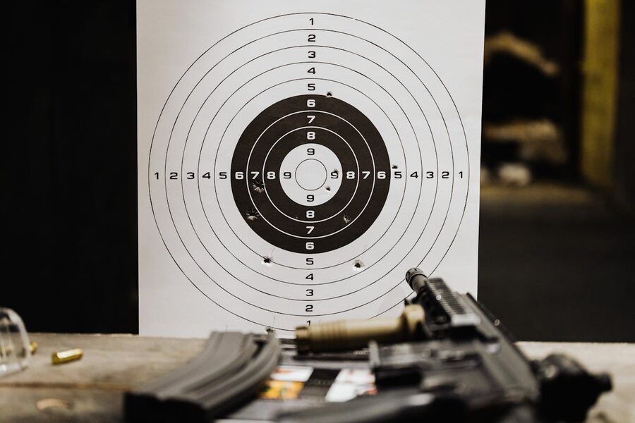 Paper shooting target with clustered bullet holes
