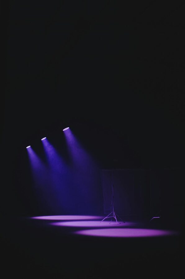 Theater stage with purple spotlights and atmosphere