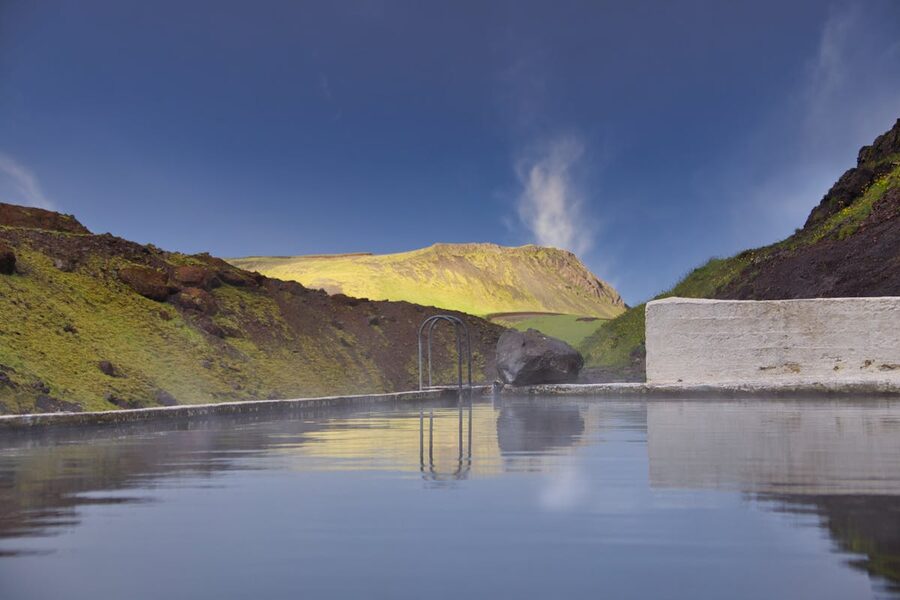 Hot spring pool in Iceland mountain setting