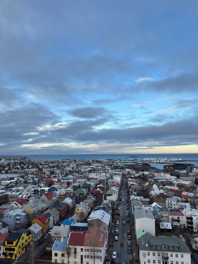 Tjornin lake reflecting Reykjavik city center buildings