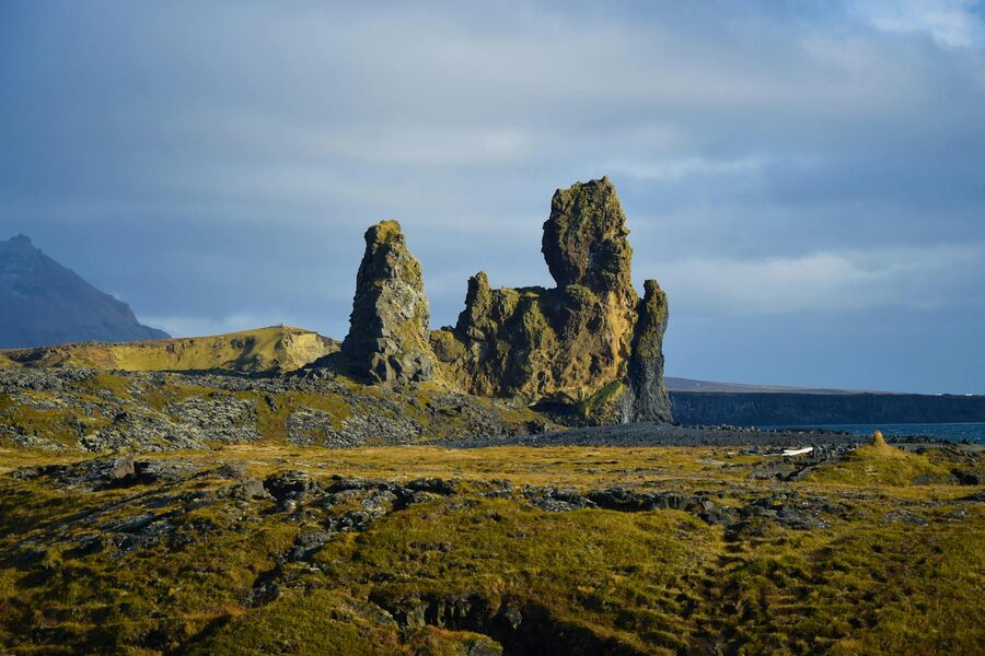 Small Icelandic fishing village with colorful boats in harbor