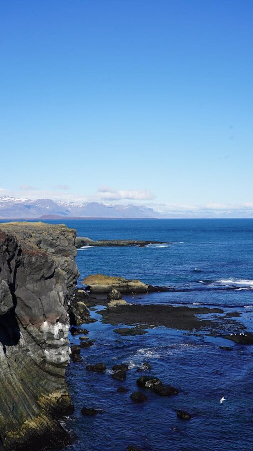 Rocky coastline with sea spray along Snaefellsnes Peninsula