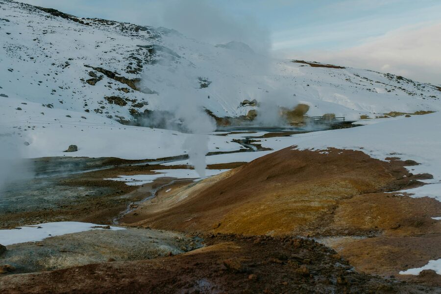 Snow-covered road winding through the Iceland winter terrain