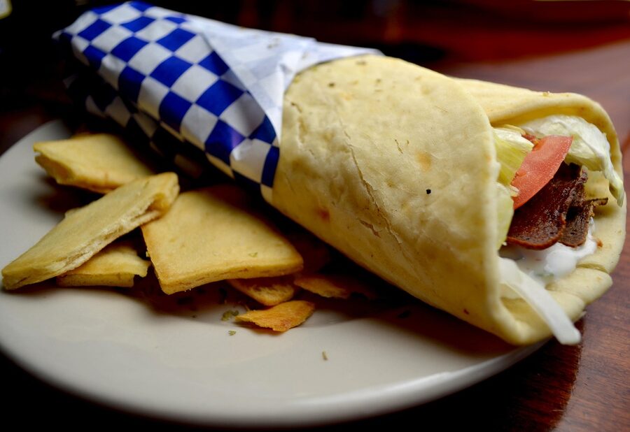 Pita bread wrap with gyros meat and vegetables