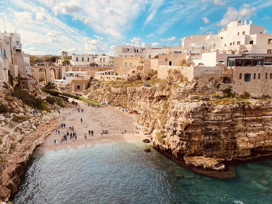 Polignano a Mare beach with rocky cliffs