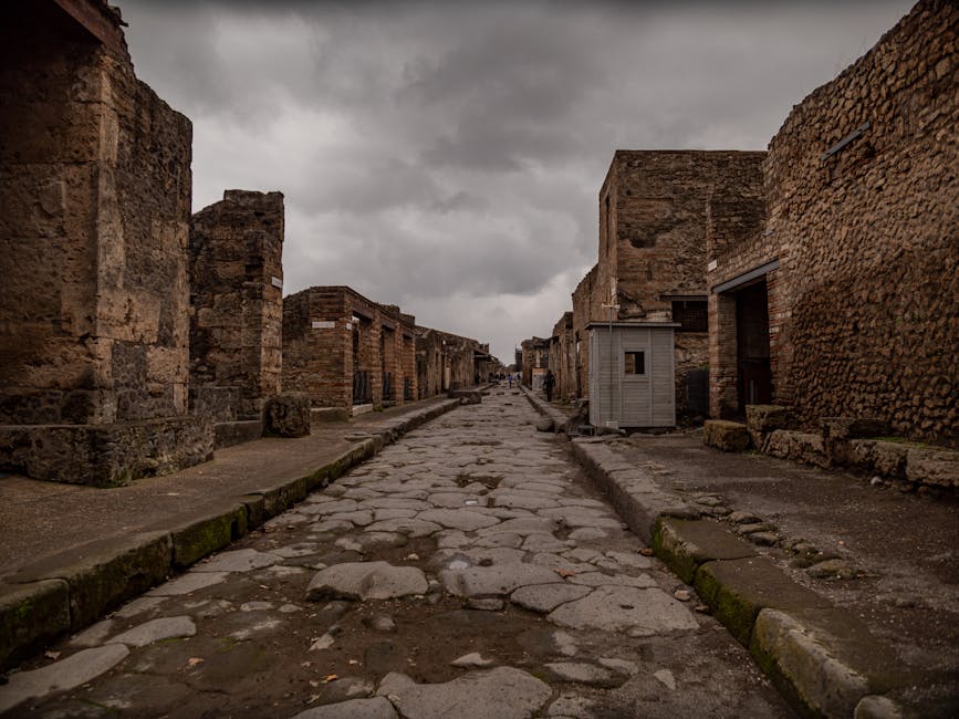 Deserted ancient street in Pompeii with historic ruins