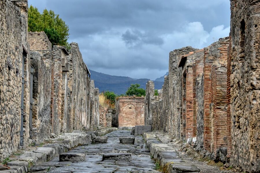 Pompeii stone ruins with distant mountains