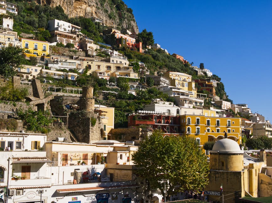Positano hillside buildings under blue sky